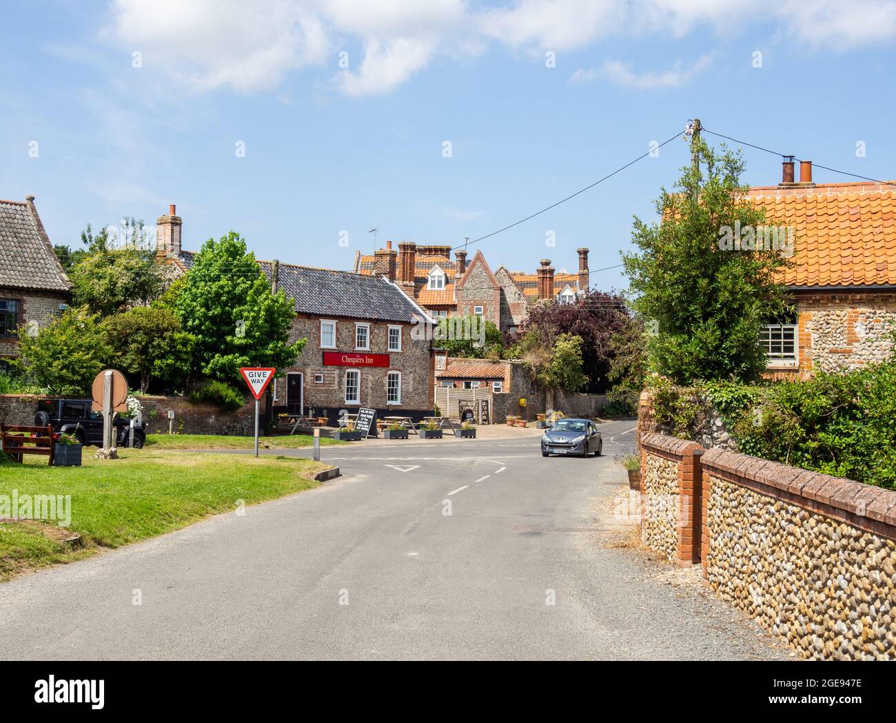 Summer street scene in the village of Binham, North Norfolk, UK Stock ...
