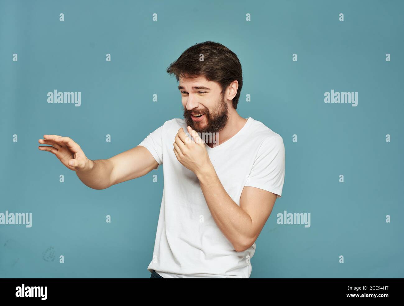 emotional man in a white t-shirt irritated facial expression Lifestyle ...
