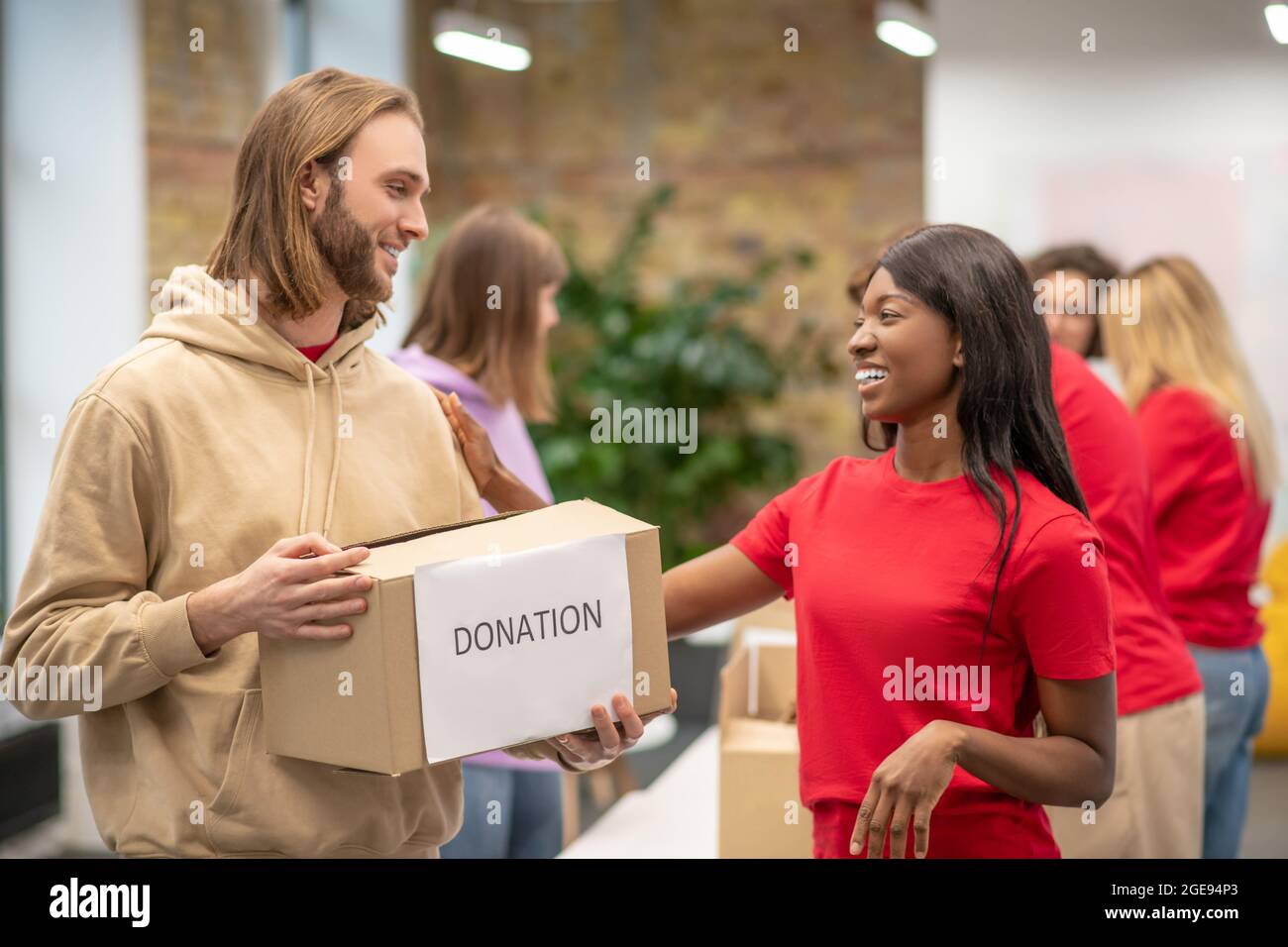 Adult african man packing boxes hi-res stock photography and images - Alamy