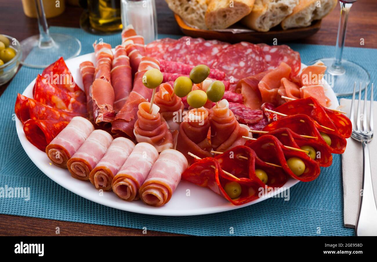 Chorizo, fuet jamon salam bacon, spanish meat antipasto platter Stock ...