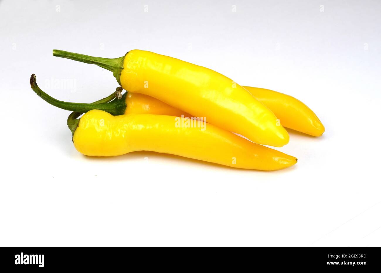 Yellow hot peppers on white background Stock Photo - Alamy