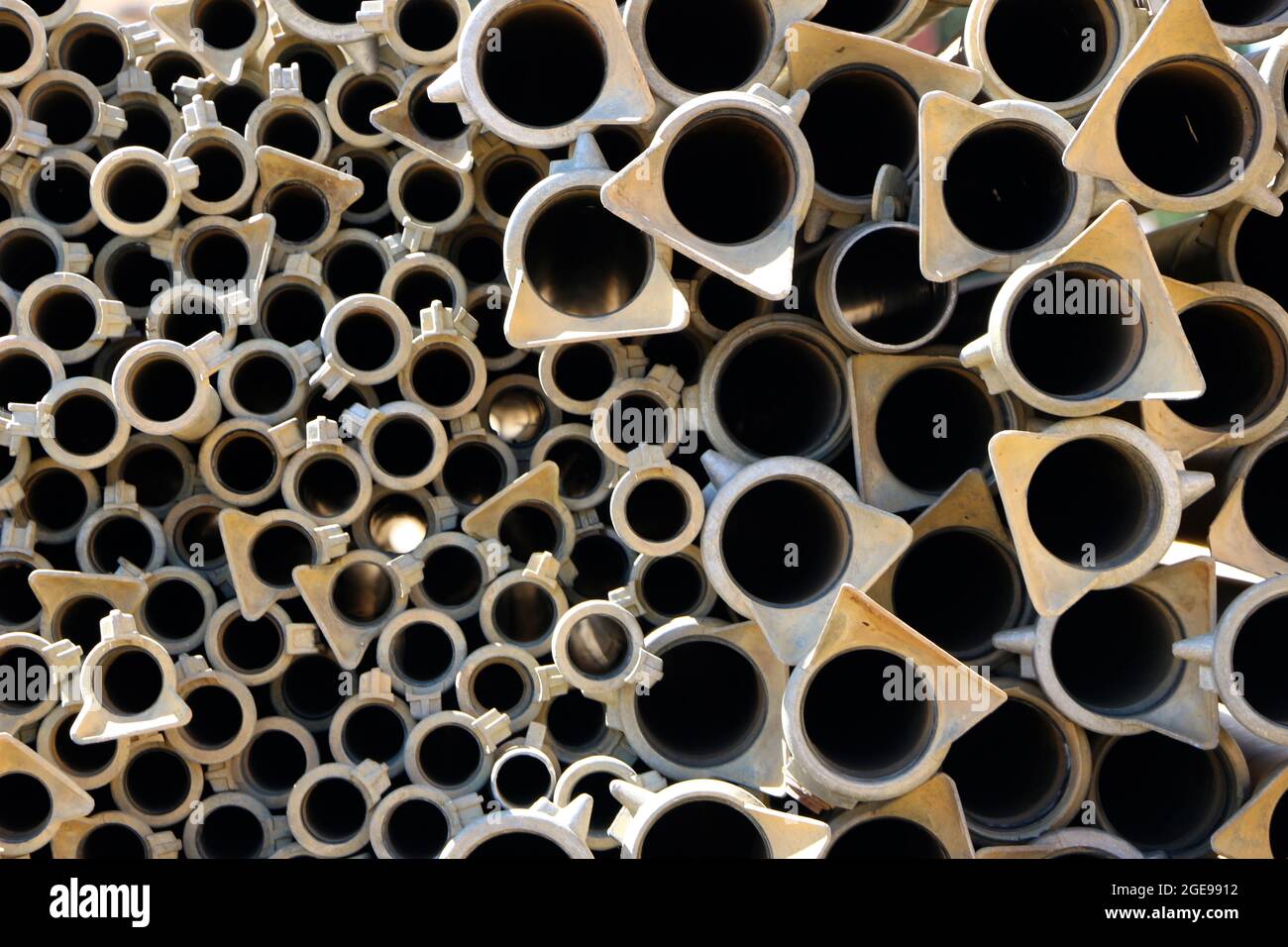 Close up of scaffolding poles looking end on Stock Photo - Alamy