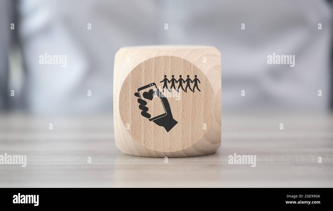 Wooden block with symbol of followers concept Stock Photo - Alamy