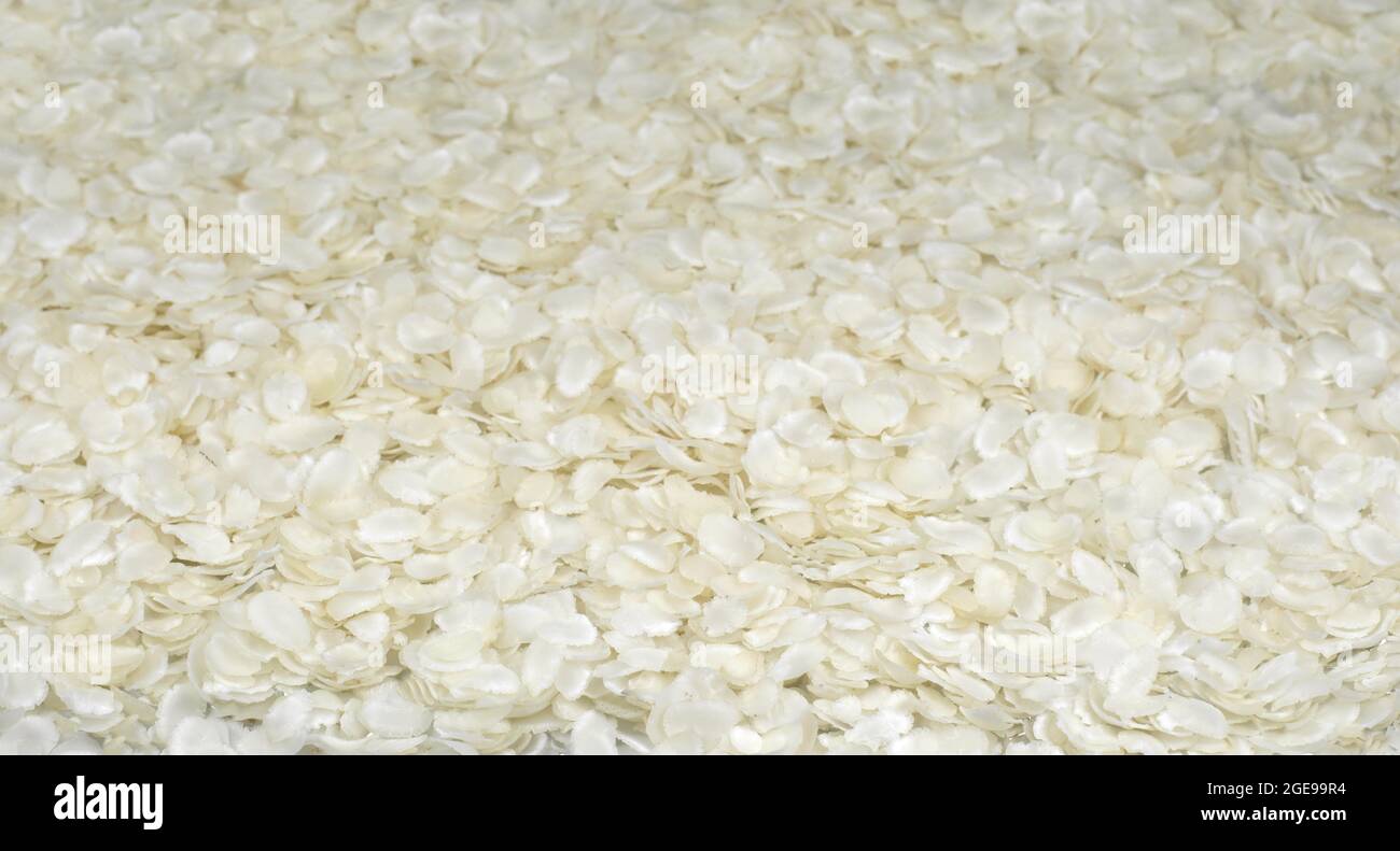 flattened rice flakes isolated on white Stock Photo - Alamy