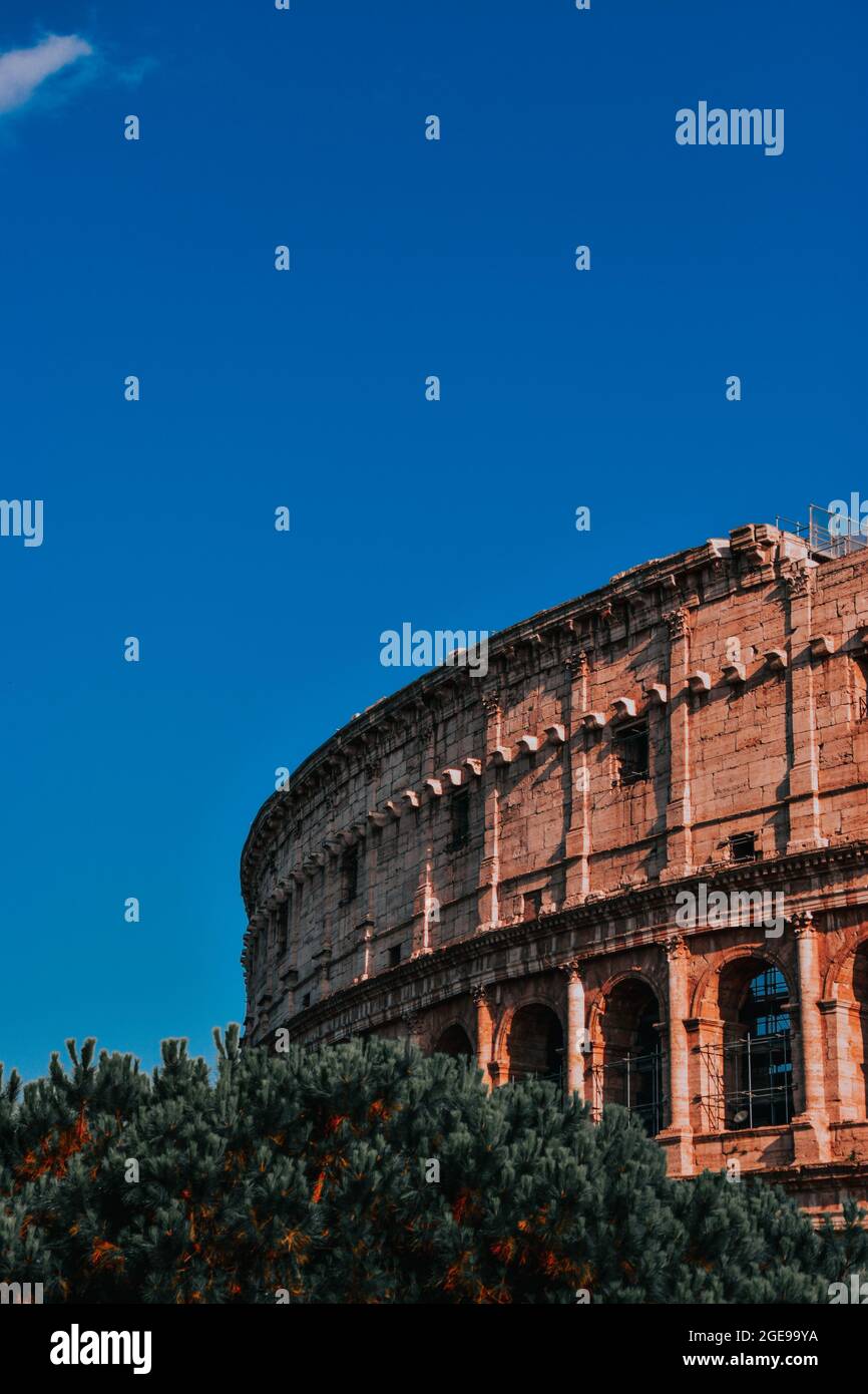 Facade of the Colosseum in Rome, Italy against a clear blue sky Stock ...