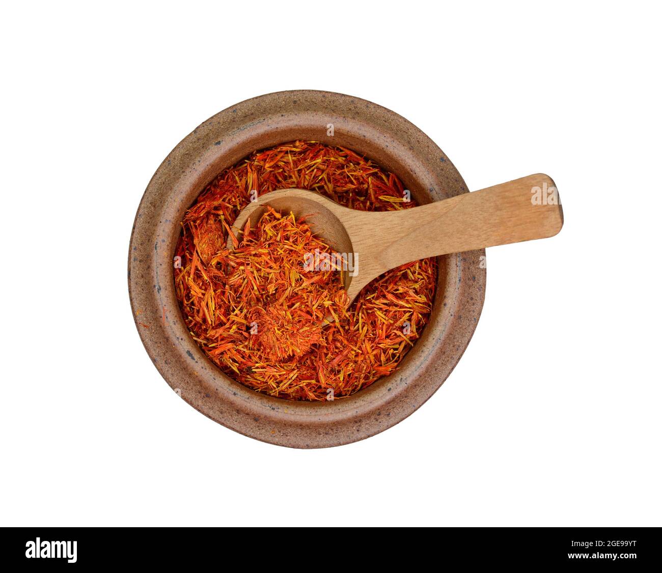 Saffron spice threads (strands) in a bowl with a wooden spoon isolated ...