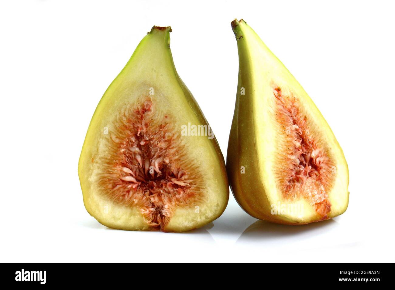 Cut figs isolated on white background Stock Photo - Alamy