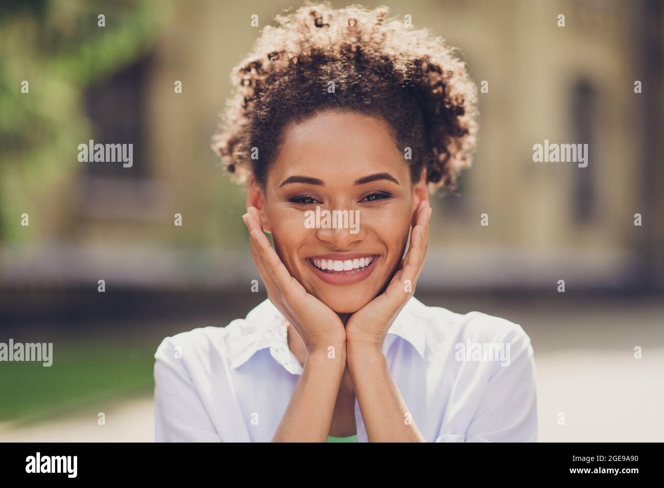 Photo Of Cheerful Happy Attractive Positive Dark Skin Woman Smile Hold