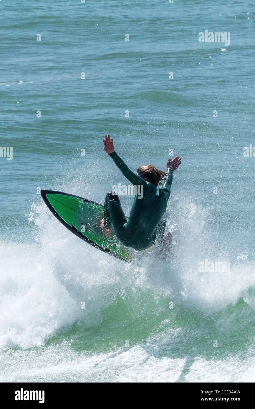Spectacular surfing action as a surfer gets airborne at Fistral in ...