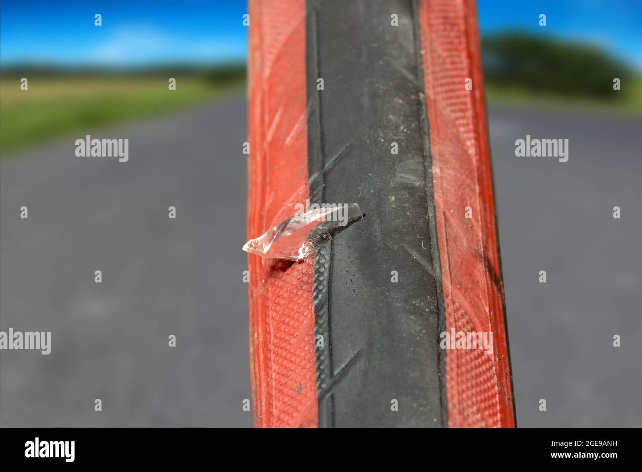 The bicycle tire is damaged by a shard of glass, close up view Stock ...