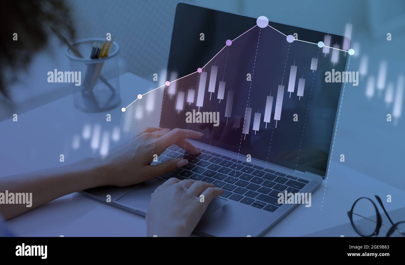 Female business analyst typing on computer, making market analysis ...