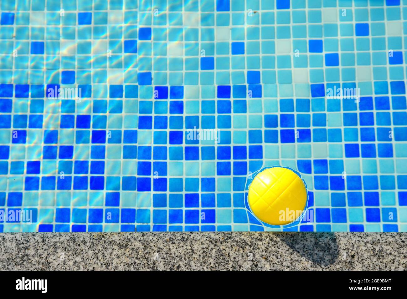 Surface of blue swimming pool with ball, background of water in ...