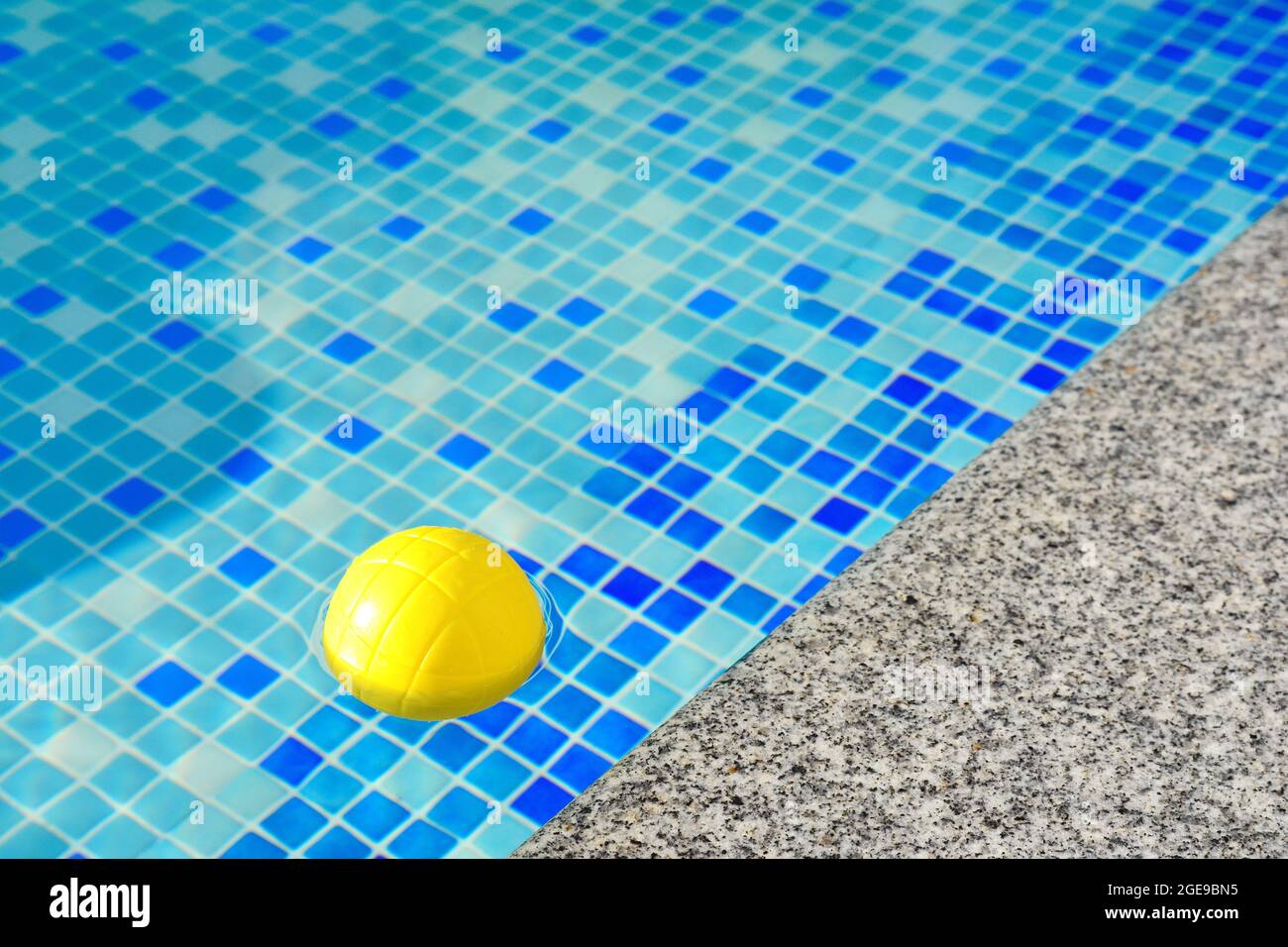Surface of blue swimming pool with ball, background of water in ...