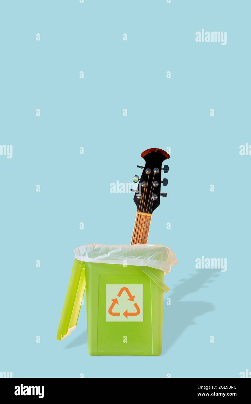 Cover page with green garbage trash bin with bag and a guitar musical ...