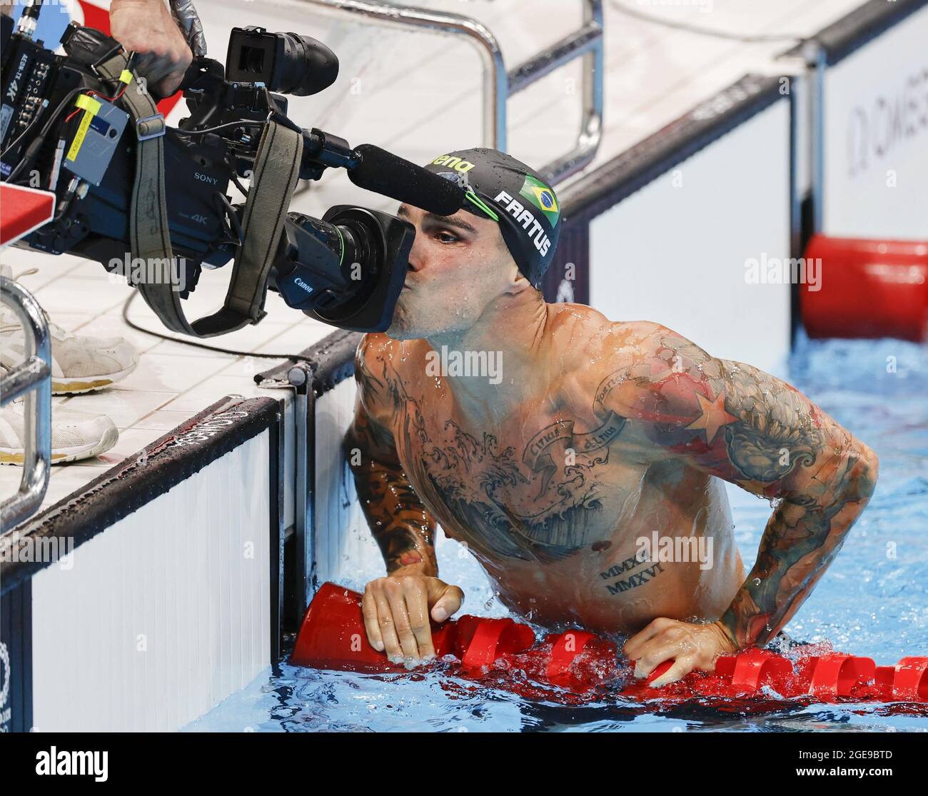 Brazil's Bruno Fratus kisses a camera after finishing first in a men's ...