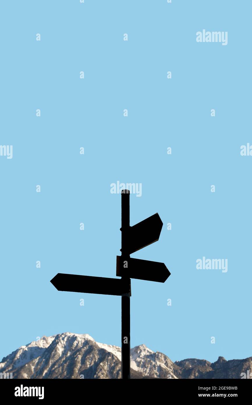 Mountains with black hiking trailhead post showing directions with copy ...