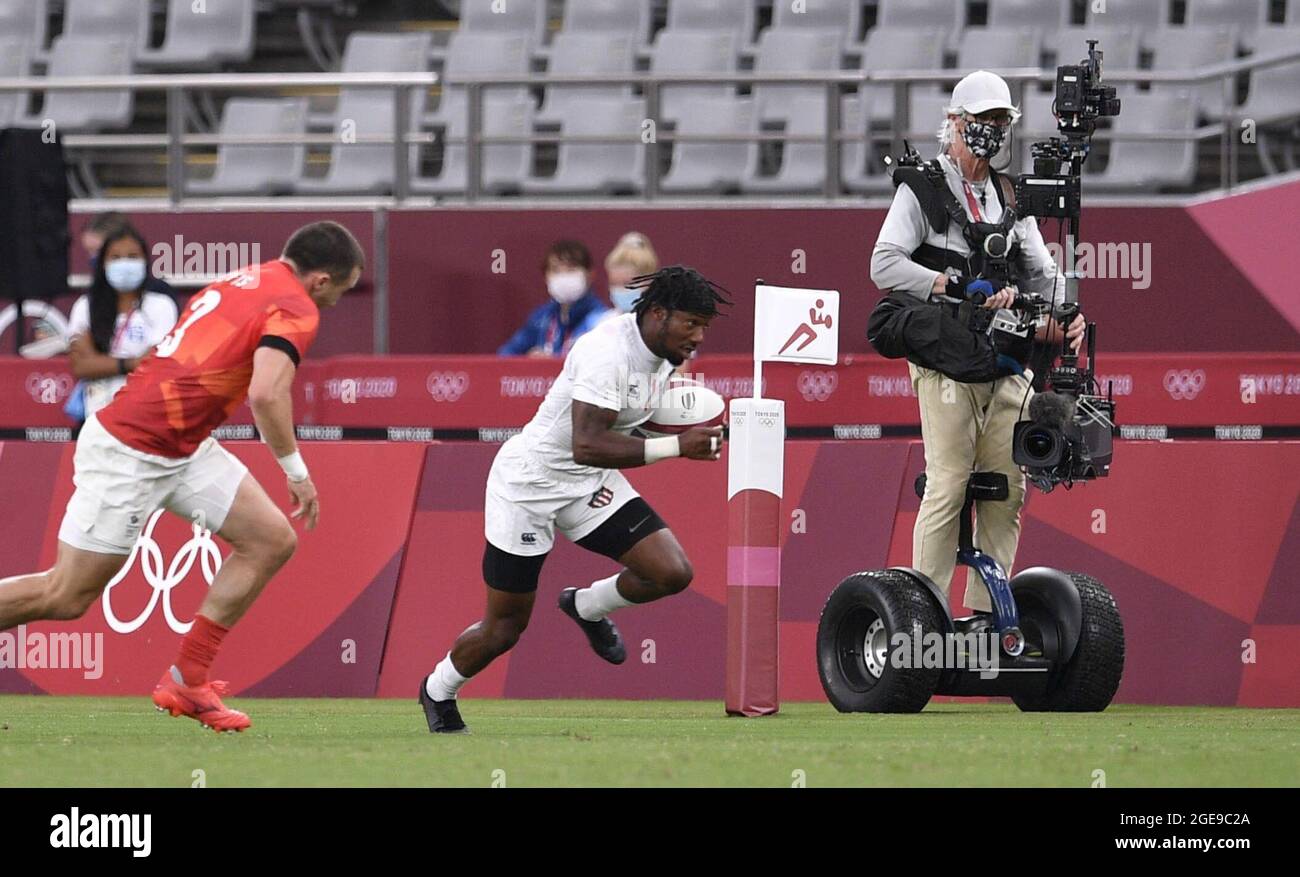 A photographer (R) rides a Segway during a rugby sevens match at the ...