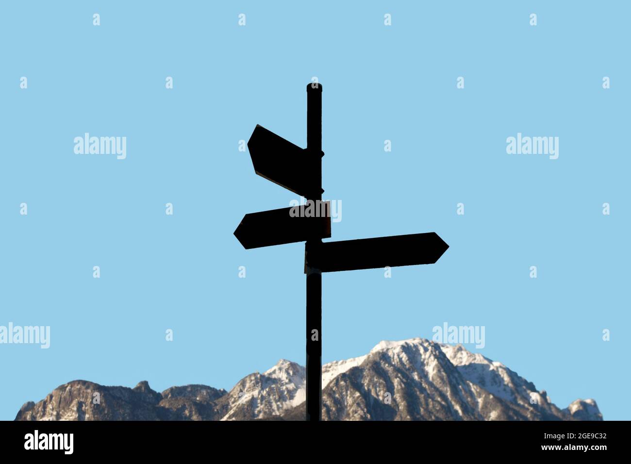 Mountains with black hiking trailhead post showing directions with copy ...