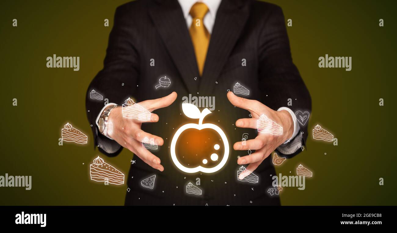 Hand holding food related icons Stock Photo - Alamy