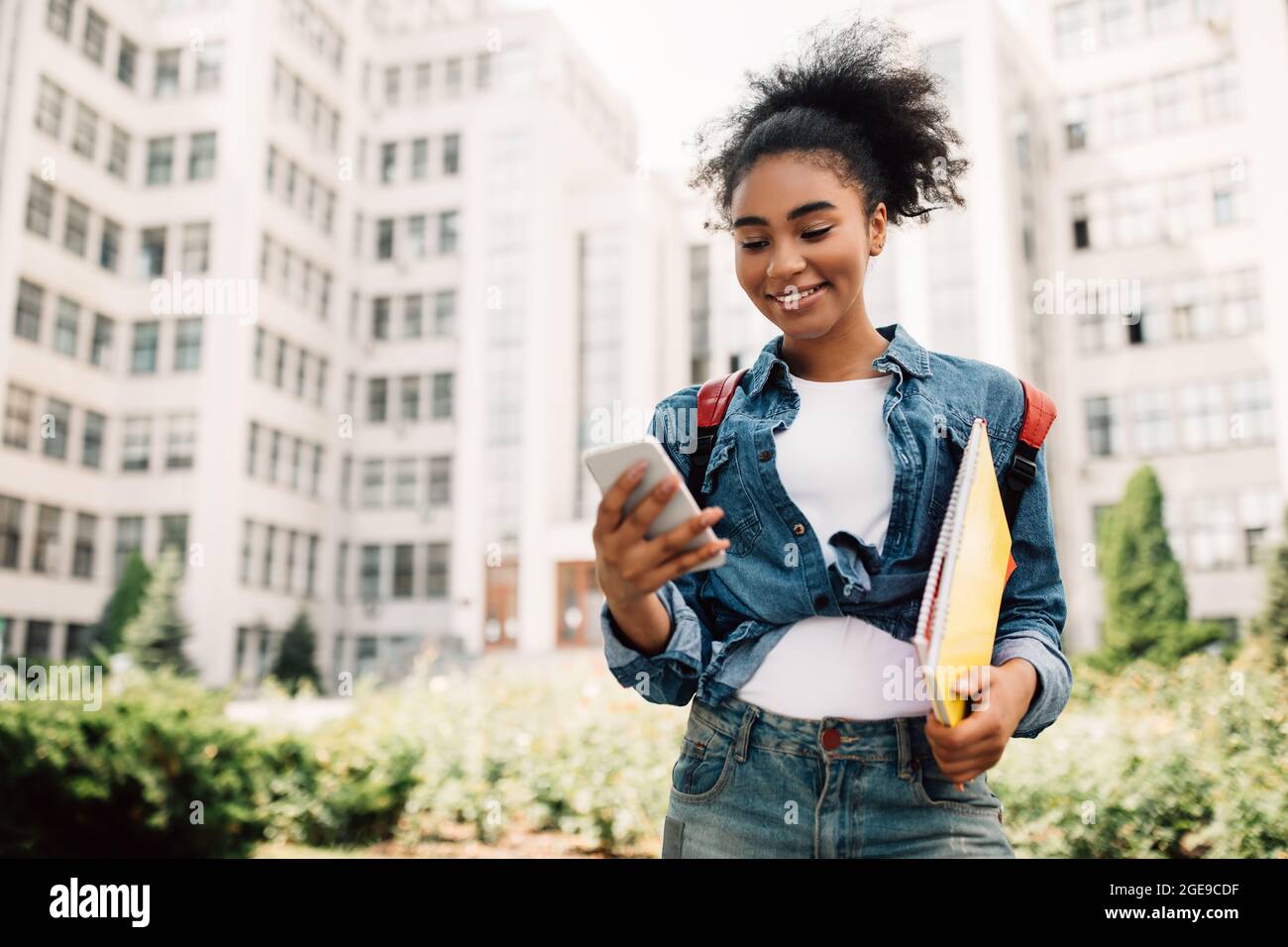 Happy African Student Girl Using Phone With Educational App Outdoors ...
