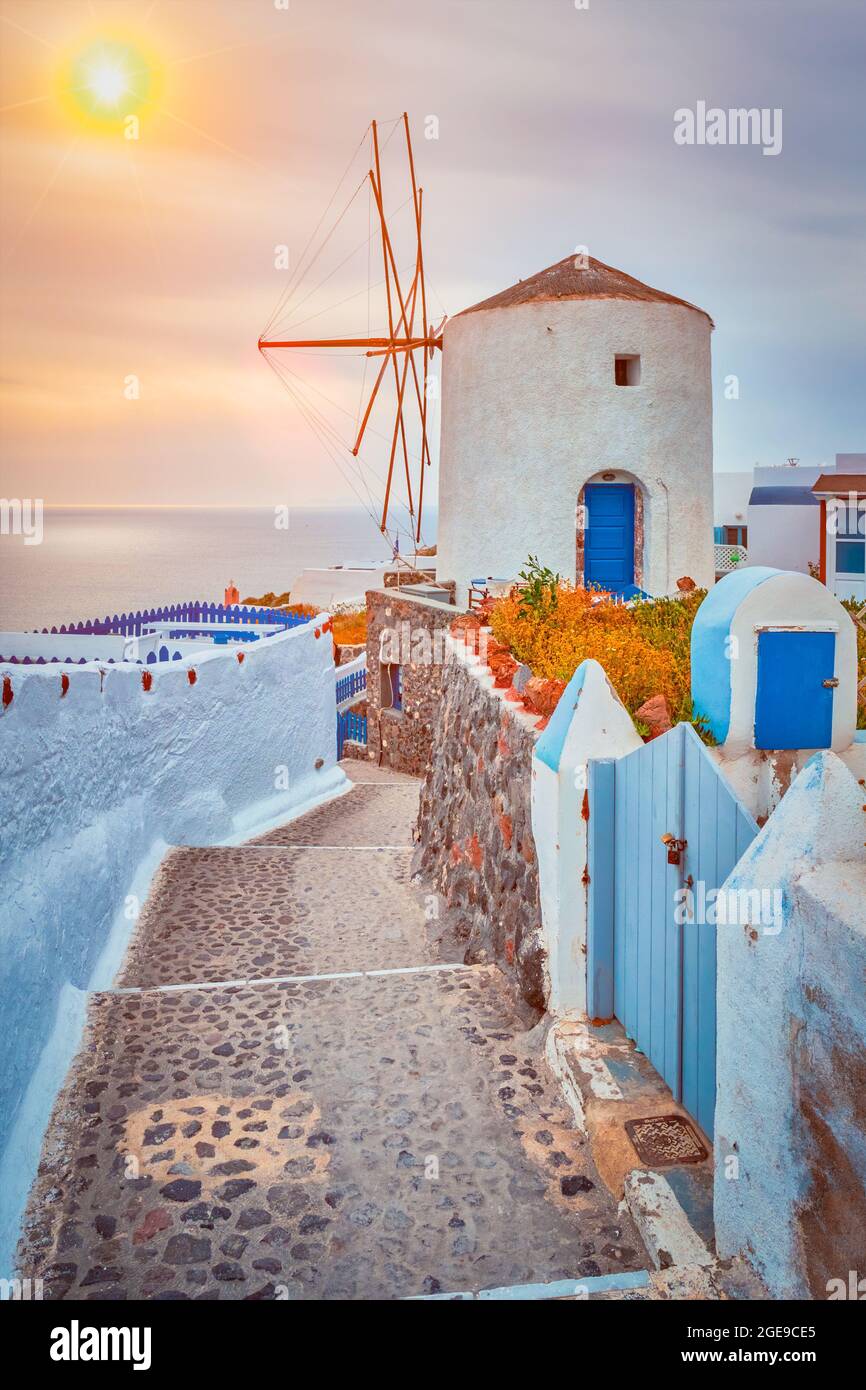 Old greek windmill on Santorini island in Oia town with stairs in ...