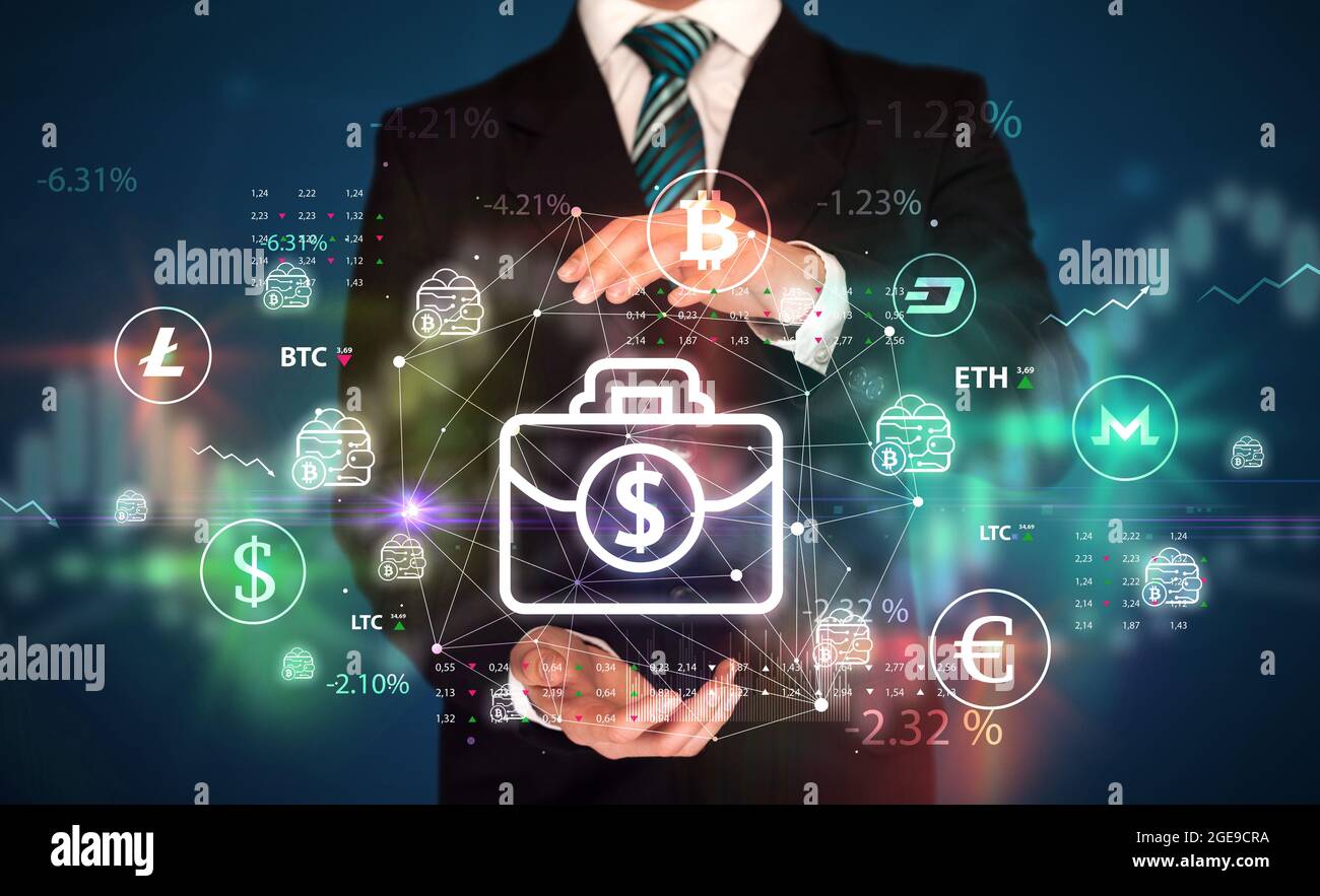Businessman holding currency symbols concept Stock Photo - Alamy