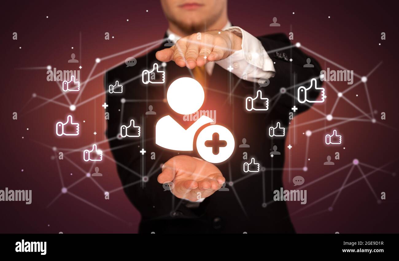Hand holding social media icons Stock Photo - Alamy