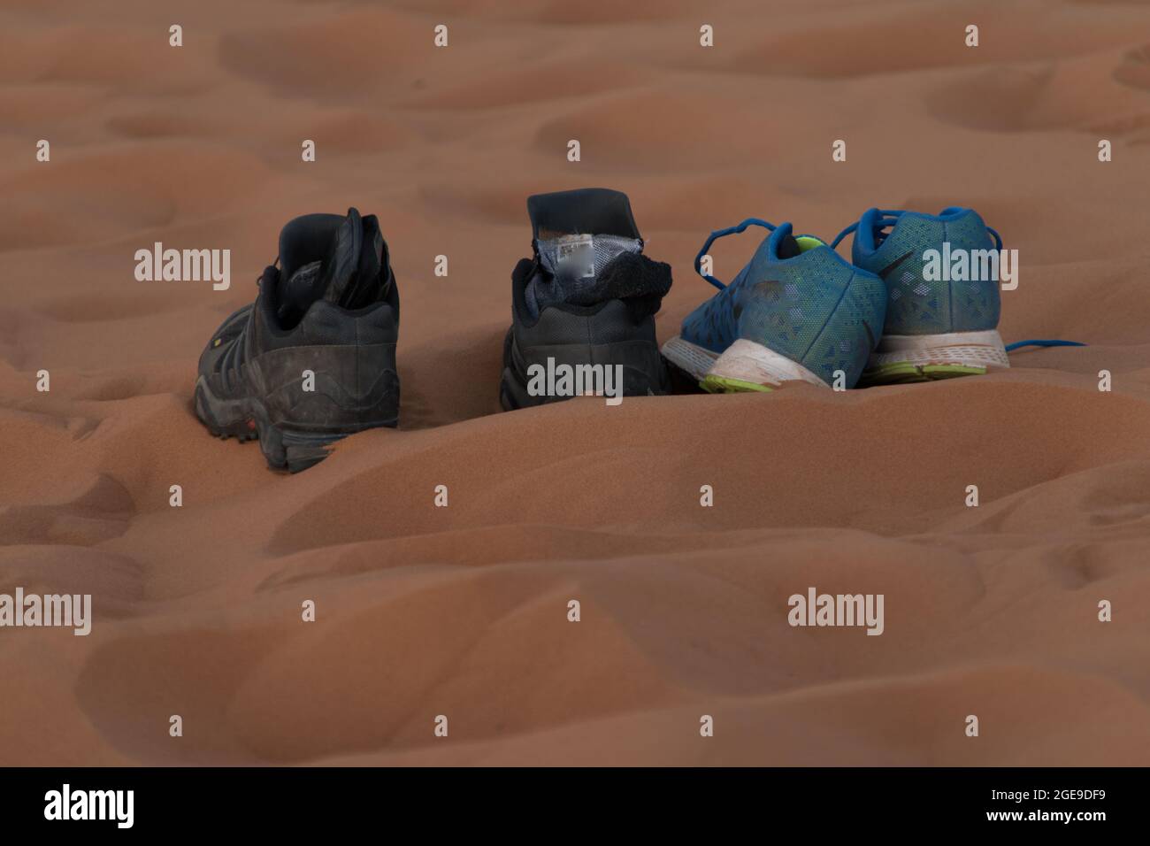 Closeup shot of two pairs of shoes on sand in the Sahara desert Stock ...
