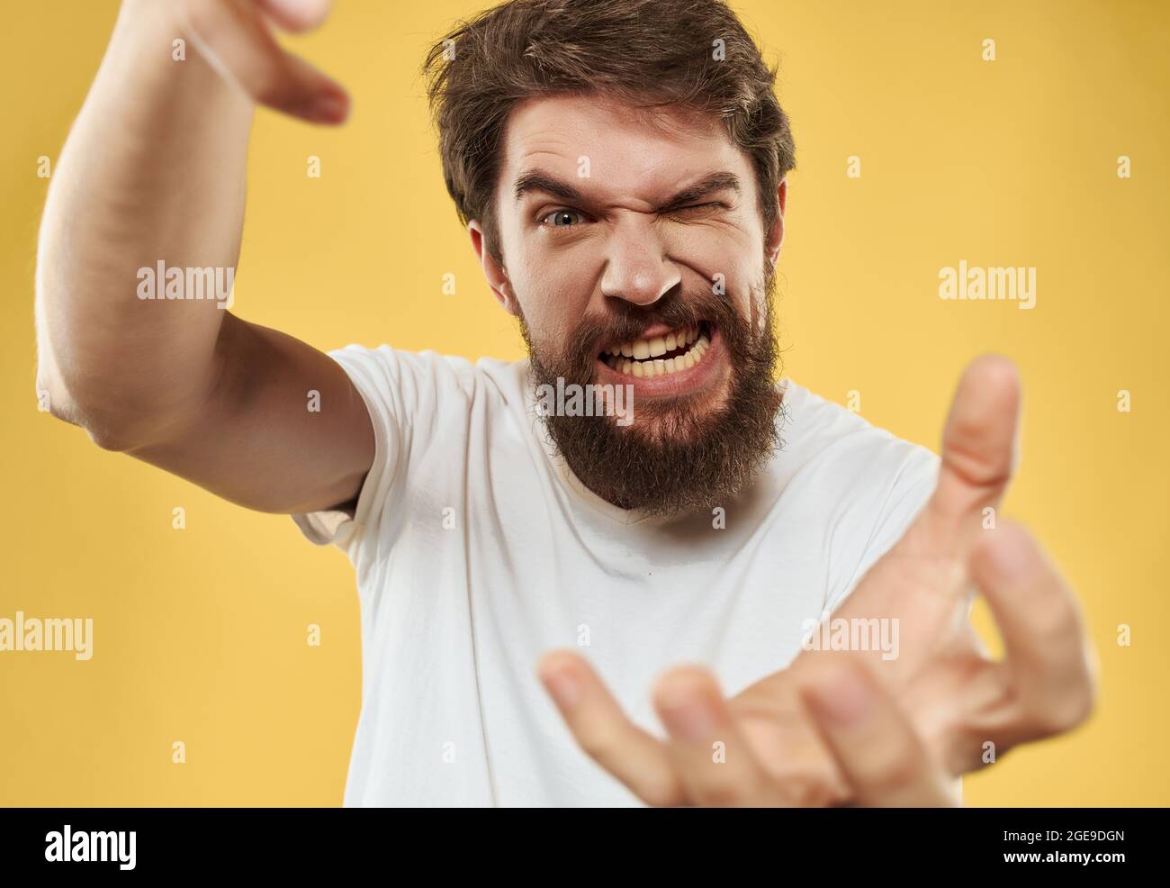 emotional man in a white t-shirt hand gestures anger Lifestyle Stock ...