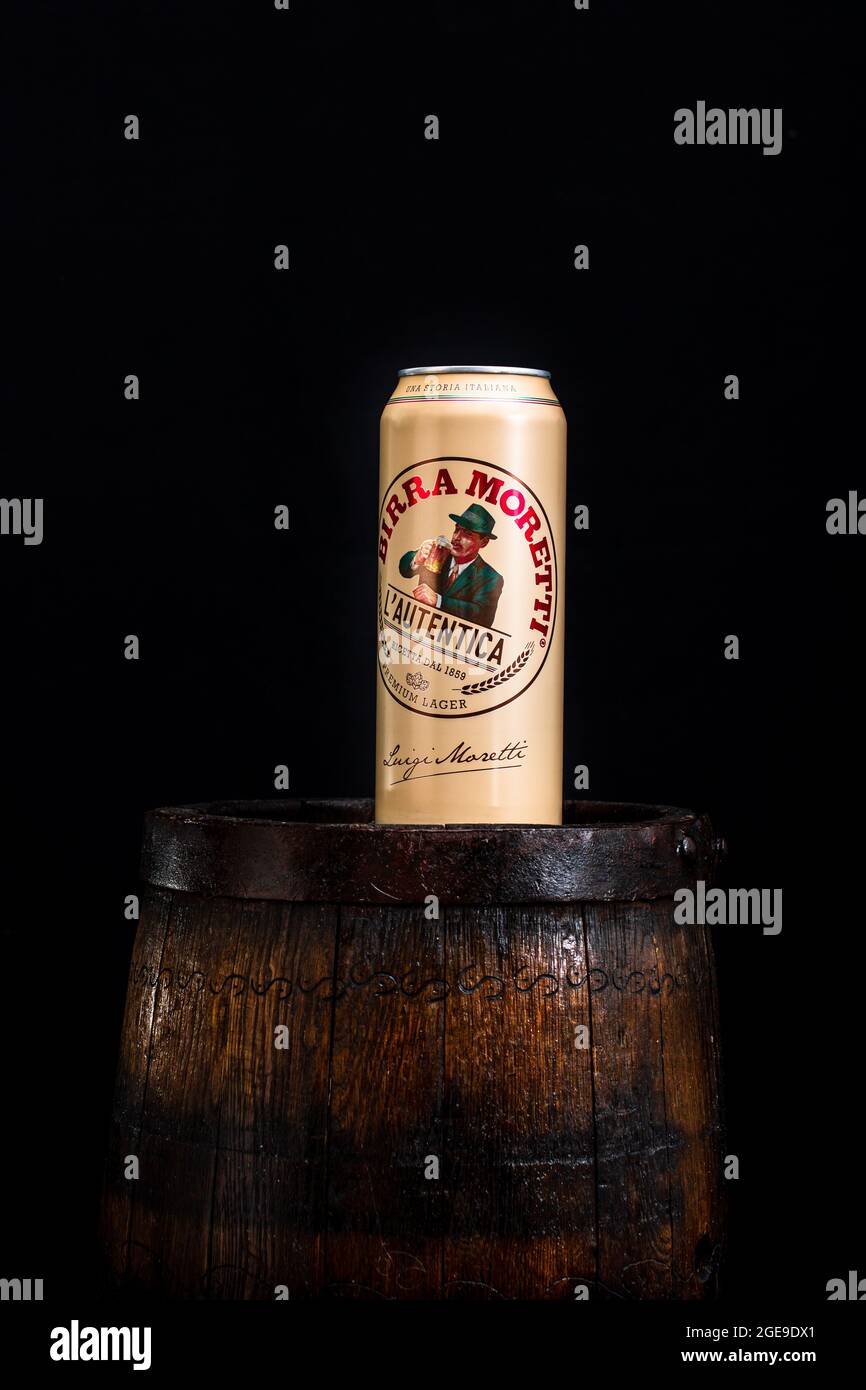 Can of Birra Moretti beer on wooden barrel with dark background ...