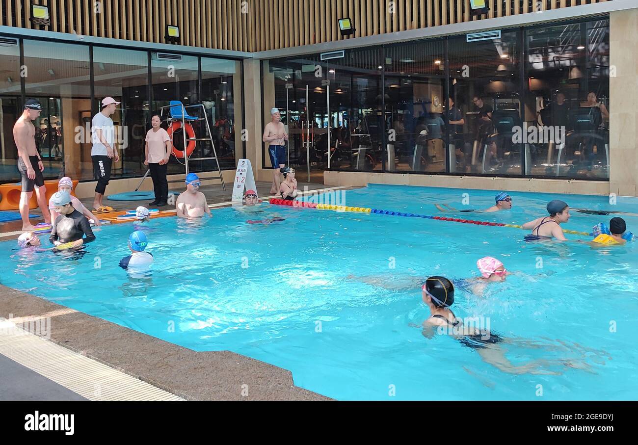 SHANGHAI, CHINA - AUGUST 12, 2020 - Citizens swim at a swimming pool in ...