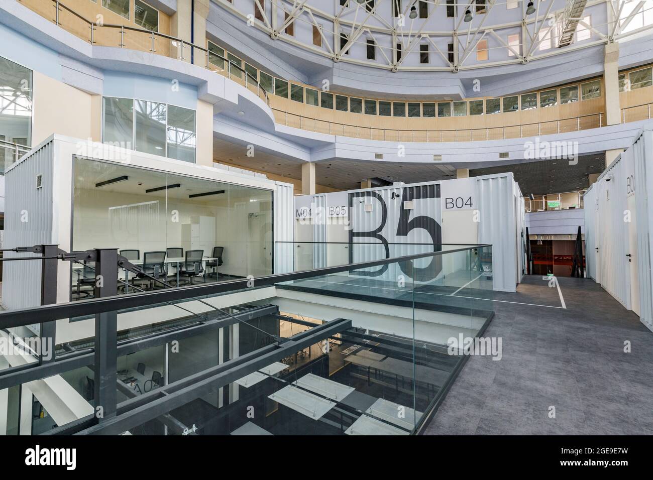 Interior of modern business center with private working rooms Stock ...