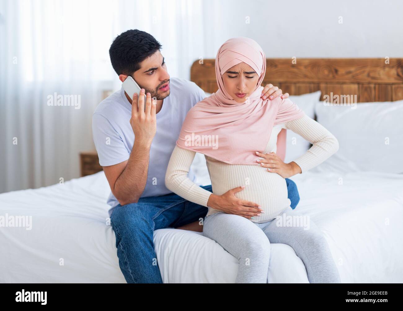 Islamic expecting mother in hijab suffering painful spasms and ...