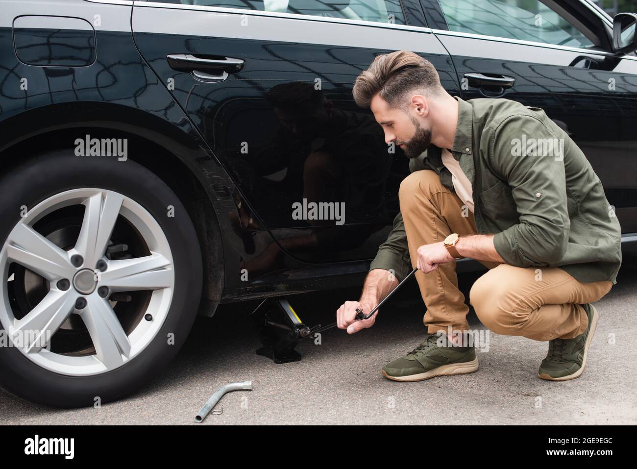 Person lifting car hi-res stock photography and images - Alamy