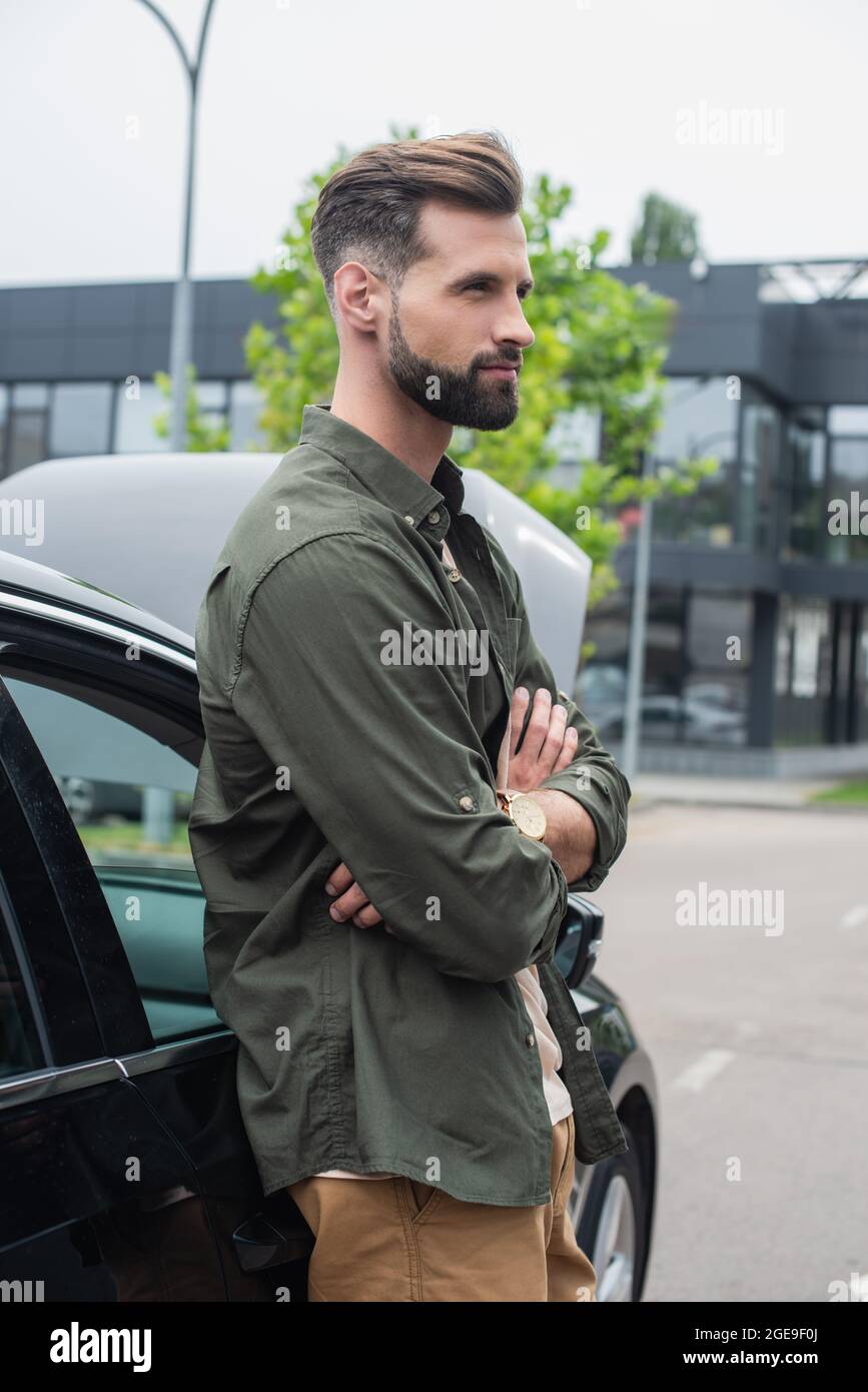 Young man side view crossed arms hi-res stock photography and images ...