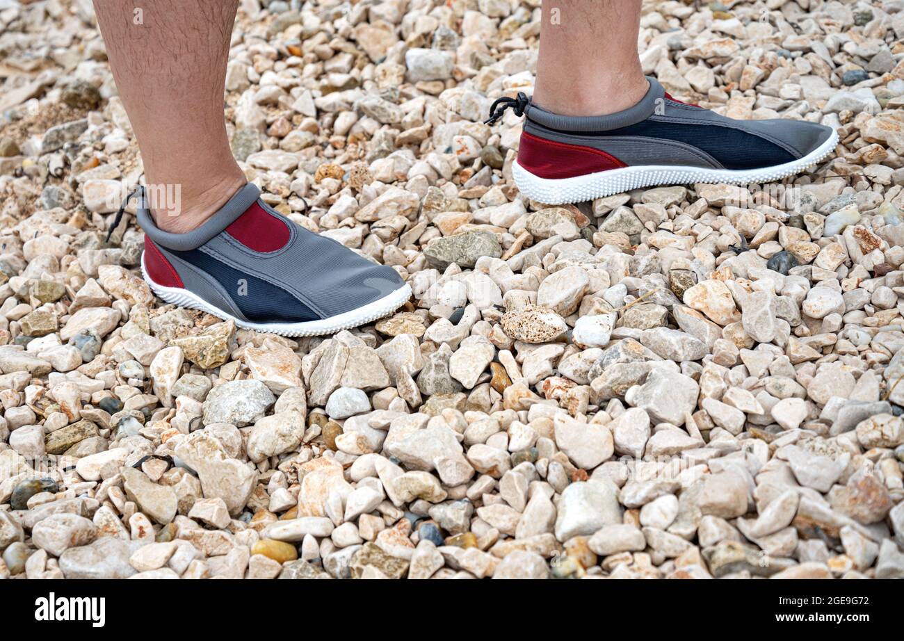 Men's feet in swimming slippers Stock Photo - Alamy
