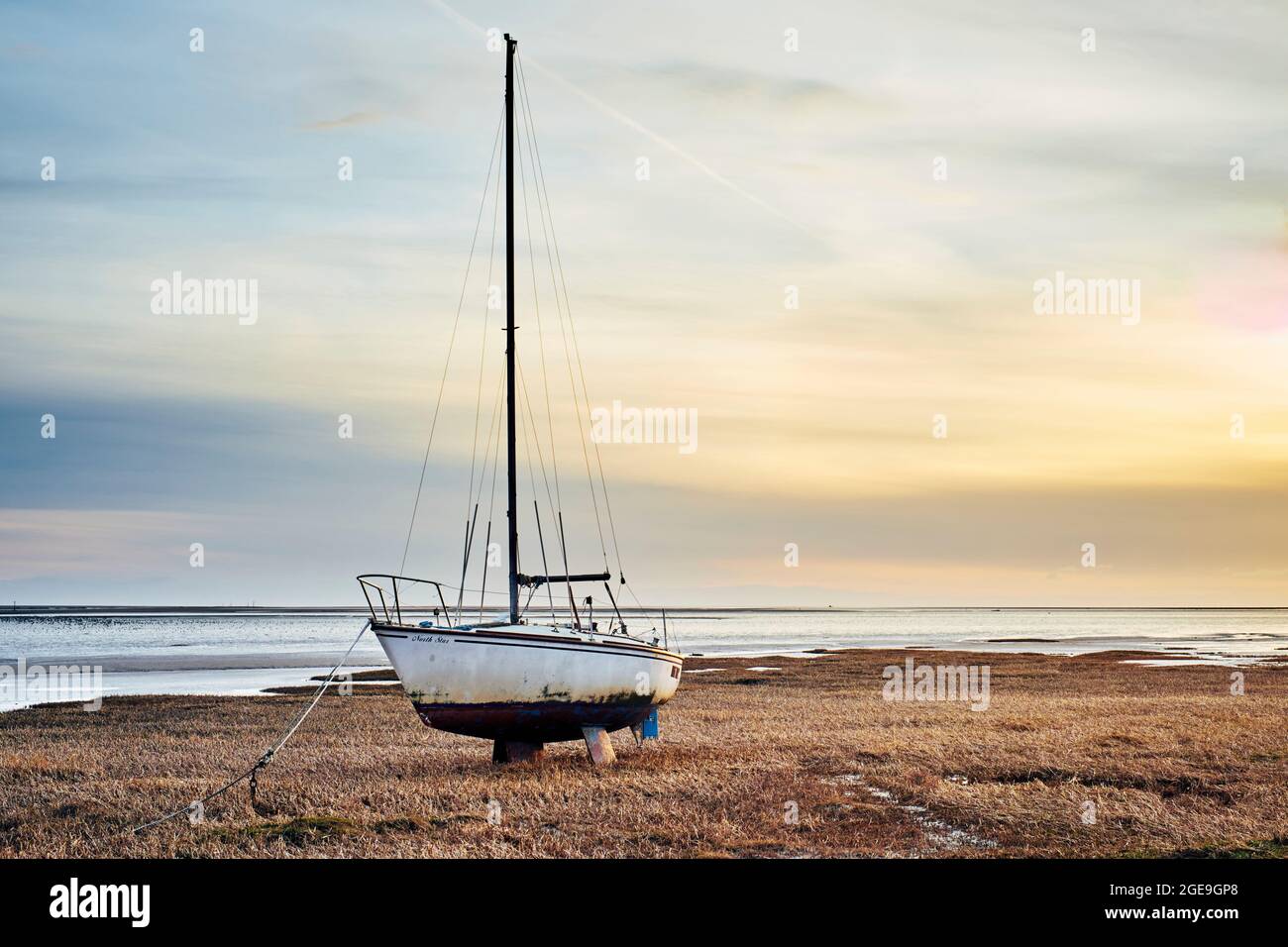 An old sailing yacht on the River Ribble marshes at Lytham St Annes ...