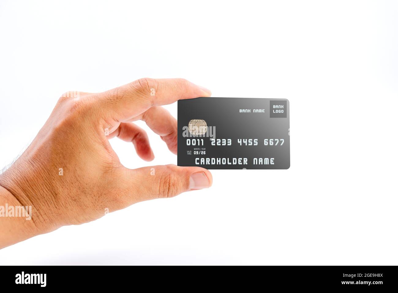Human hand holding black color bank credit card on white background ...