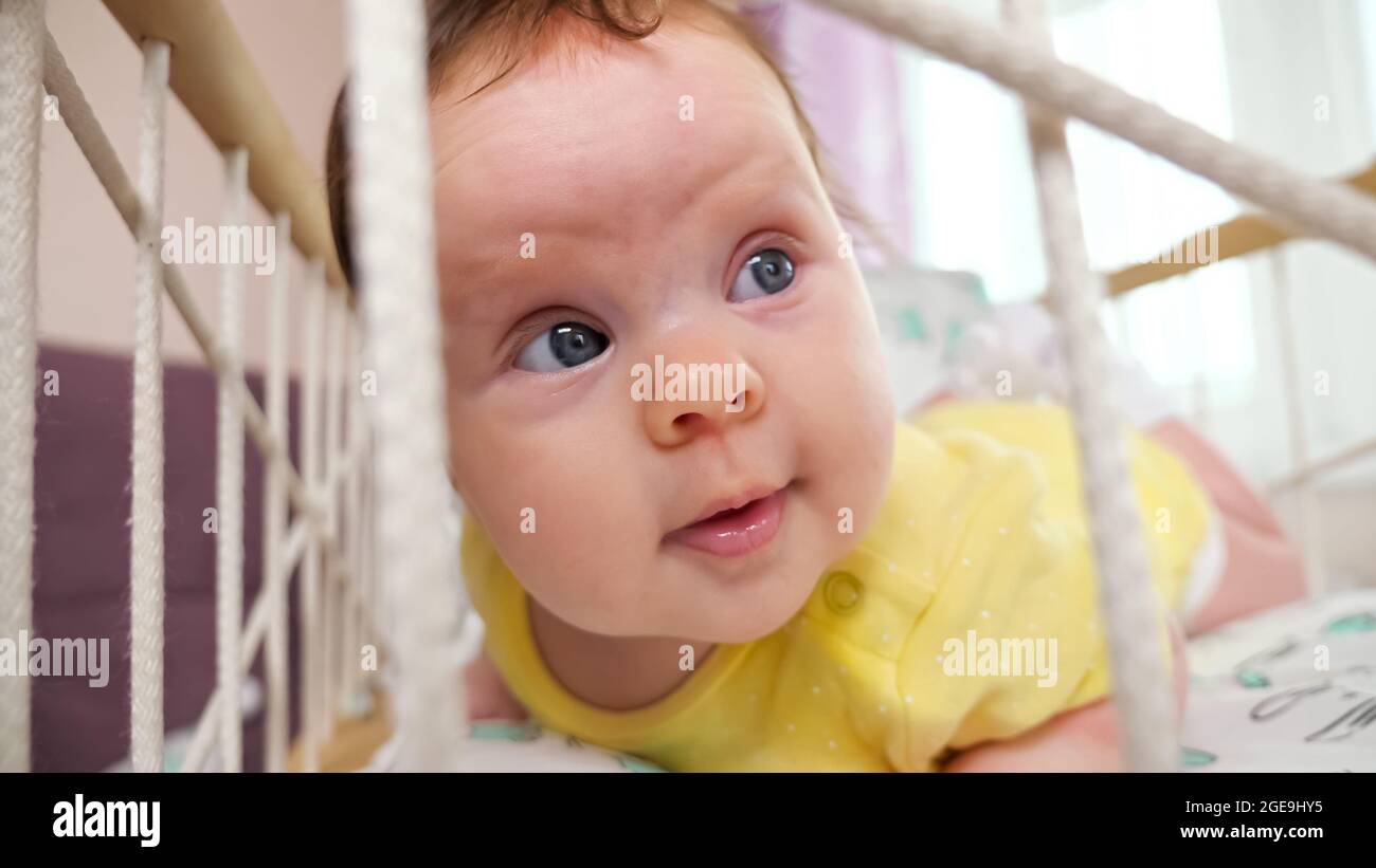 Baby in rocking cradle hi-res stock photography and images - Alamy