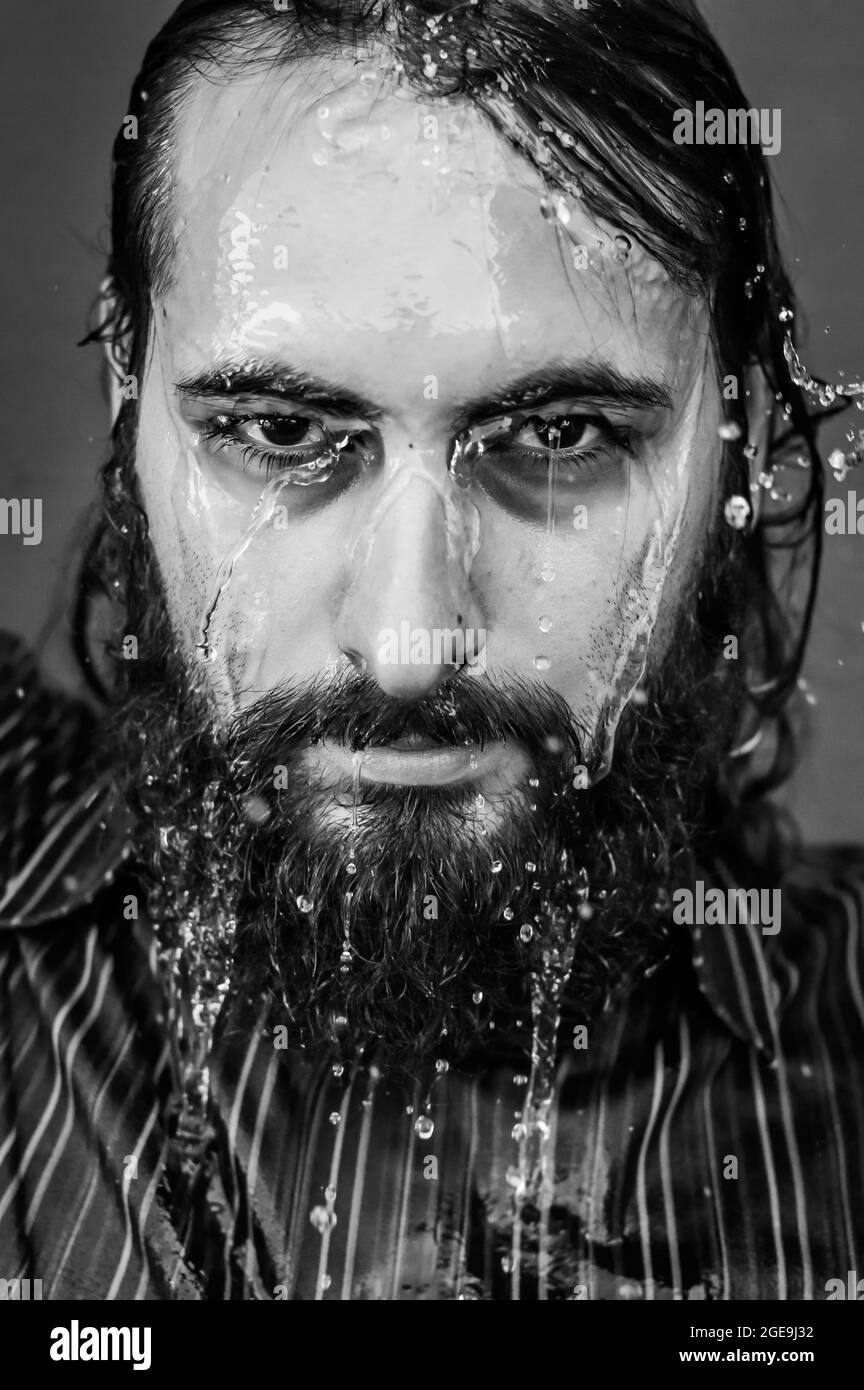 Young man crying tears Black and White Stock Photos & Images - Alamy