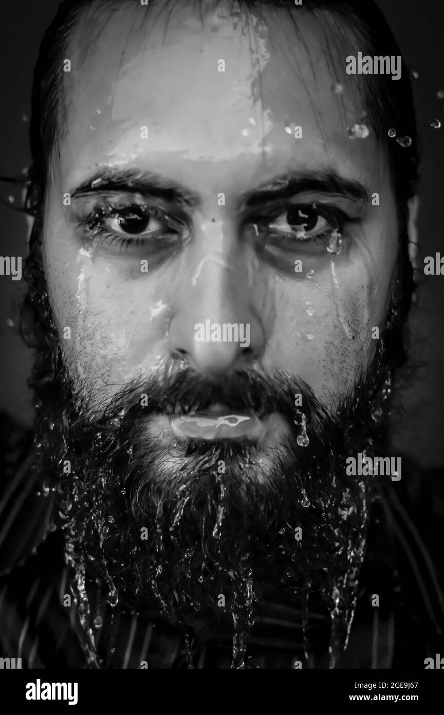 Young man crying tears Black and White Stock Photos & Images - Alamy