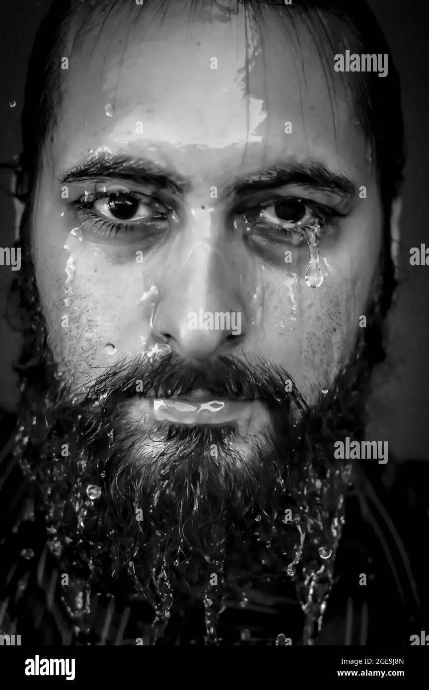 Young man crying tears Black and White Stock Photos & Images - Alamy