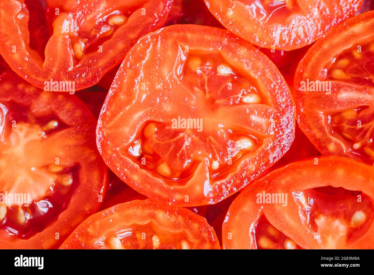 Fresh red sliced tomato, food background Stock Photo - Alamy