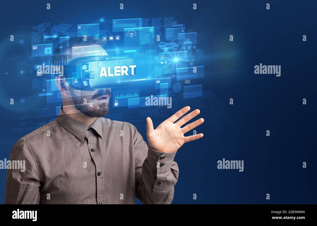 Businessman looking through Virtual Reality glasses Stock Photo - Alamy