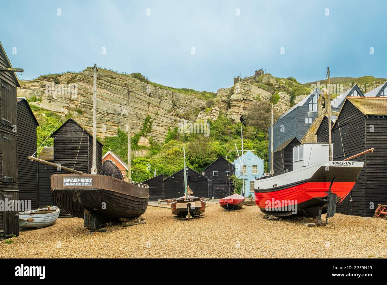 Old boats and net shops on Hastings heritage trail Stock Photo - Alamy