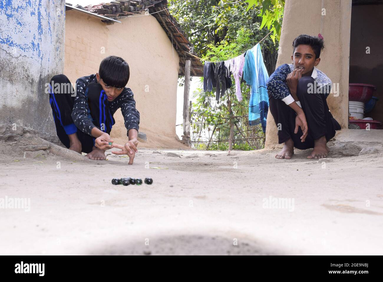 India, Indian children playing marbles in the village, Beautiful view ...