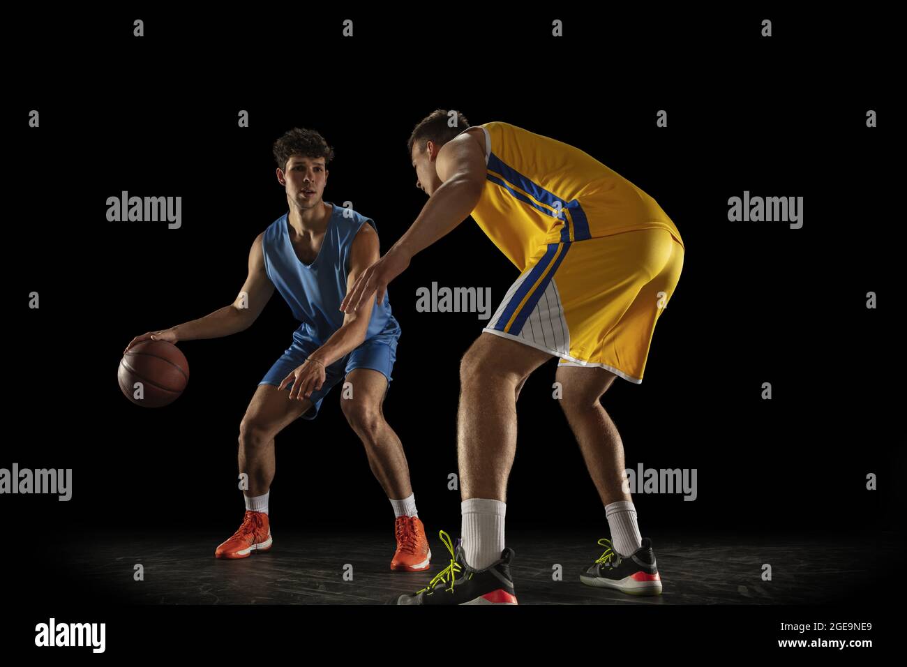 Competitive sport. Two male athletes, professional basketball players ...
