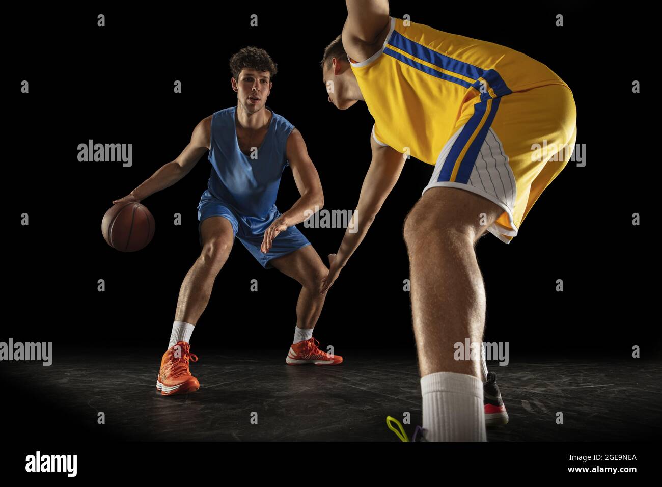 Competitive sport. Two male athletes, professional basketball players ...
