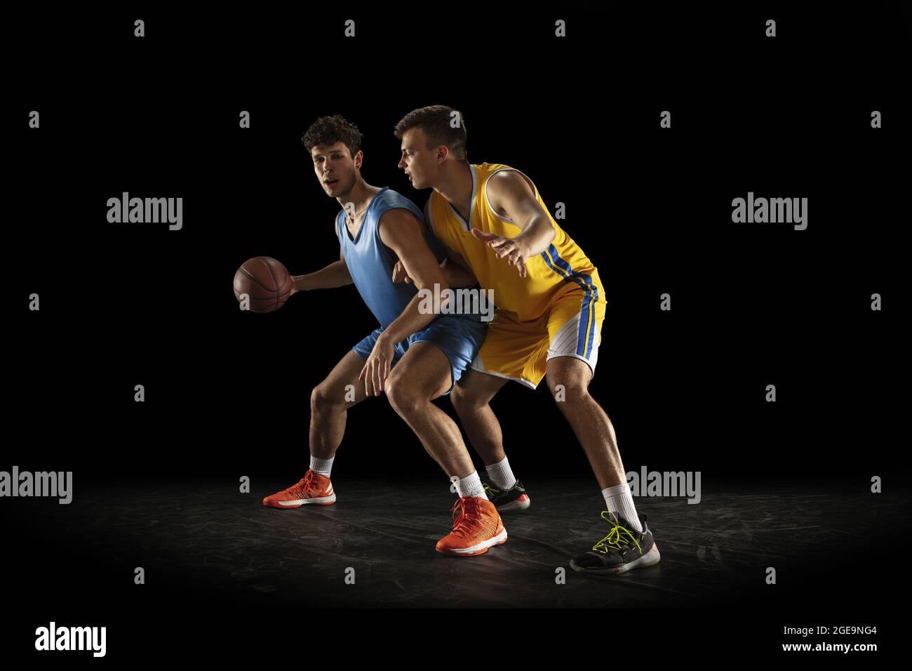 Competitive sport. Two male athletes, professional basketball players ...