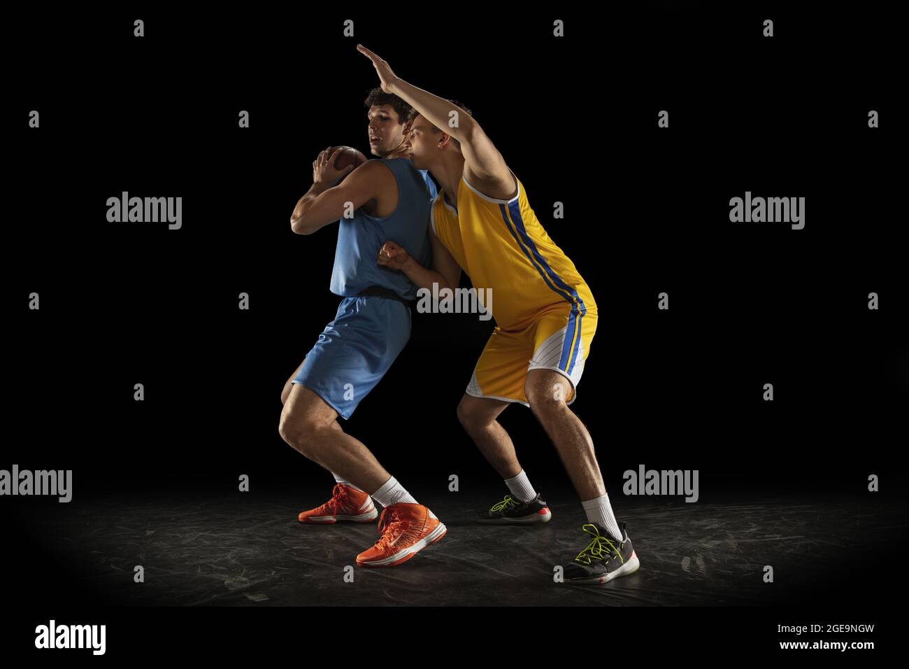 Competitive sport. Two male athletes, professional basketball players ...